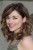 Crystal Reed Wavy Light Brown Sideswept Bangs Hairstyle | Steal Her Style