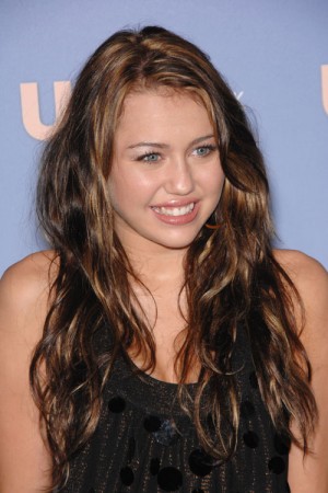 Miley Cyrus Wavy Medium Brown Hairstyle | Steal Her Style