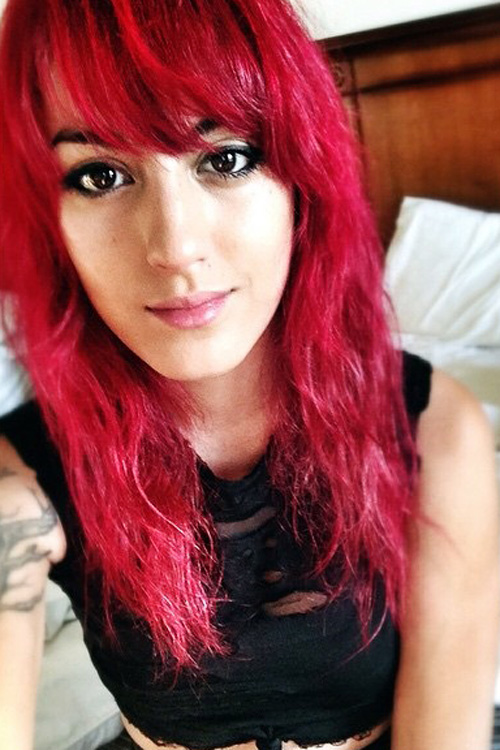 Anissa Rodriguez Wavy Red Choppy Bangs Hairstyle | Steal Her Style