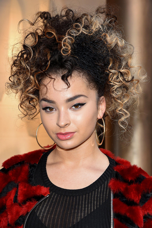 Ella Eyre Curly, Teased Dark Brown Afro, Peek-A-Boo Highlights, Updo Hairstyle | Steal Her Style