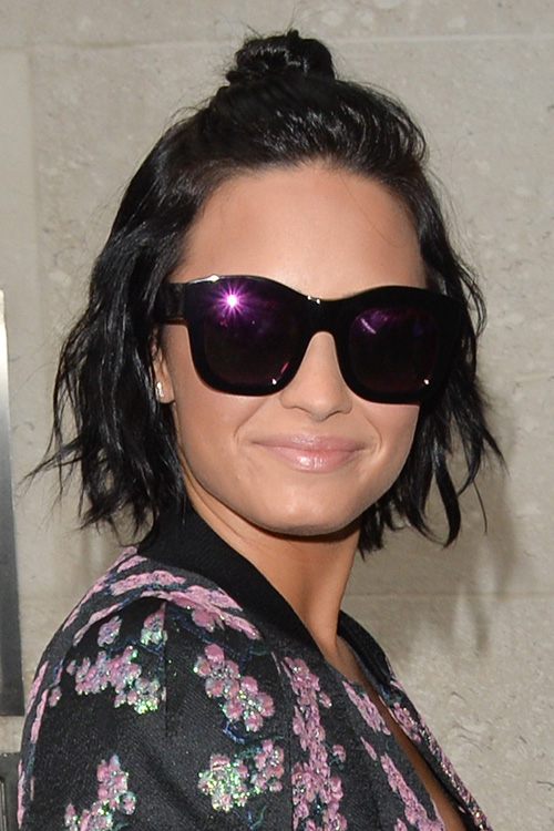 Demi Lovato Wavy Black Bun, Half-Up Half-Down Hairstyle | Steal Her Style