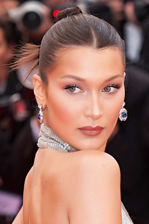 Bella Hadid Straight Medium Brown Bun Hairstyle | Steal Her Style