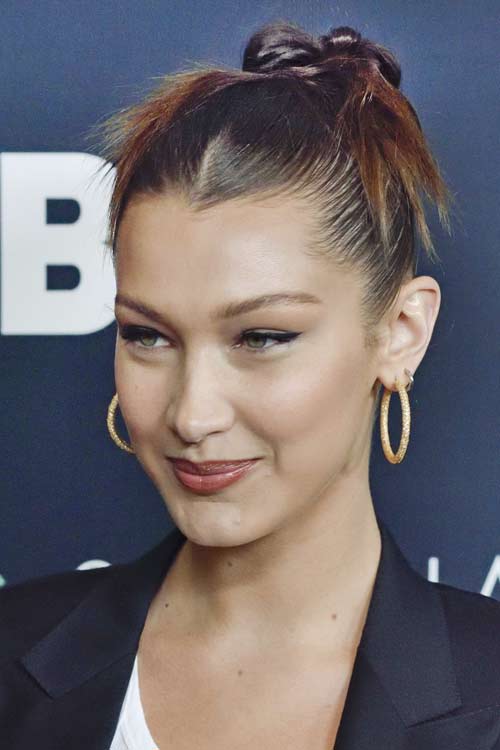 Bella Hadid Straight Dark Brown Bun Hairstyle | Steal Her Style