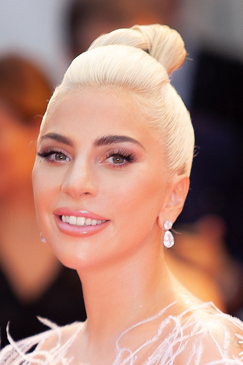 Lady Gaga Straight Platinum Blonde Bun, Updo Hairstyle | Steal Her Style